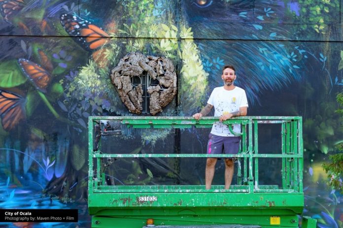 Miami-based artist completes ‘living art mural’ on wall of Brick City ...
