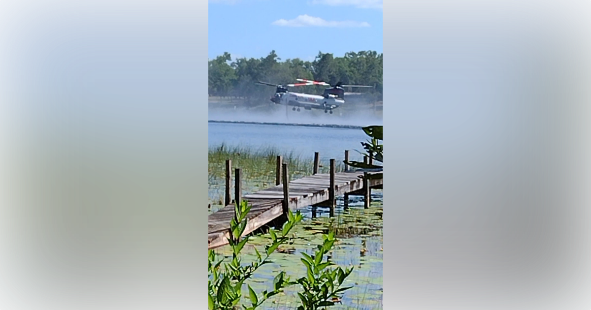 Firefighting helicopter pulling water from Lake Waldena - Ocala-News.com